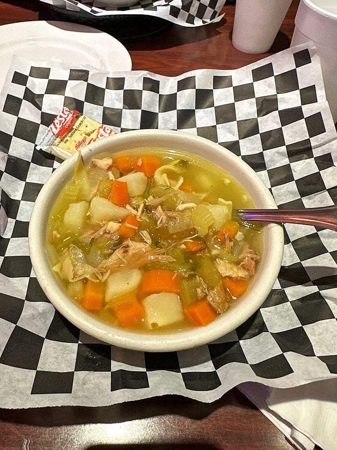 Chicken soup: the universal language of comfort. Chunks of tender chicken, vegetables, and noodles swimming in golden broth—grandma would approve.