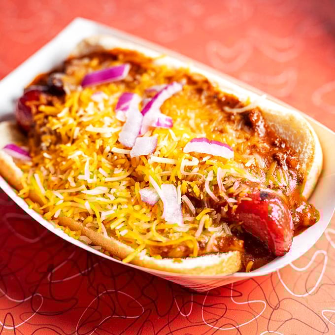 This chili dog didn't come to play—it came to conquer. Topped with chili, cheese, and onions, it's a beautiful mess worth every napkin in Wisconsin.