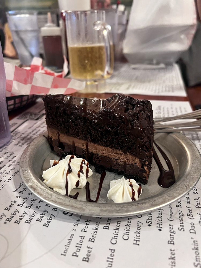 A slice of chocolate cake so decadent it requires a moment of silence before diving in – dessert as a religious experience.