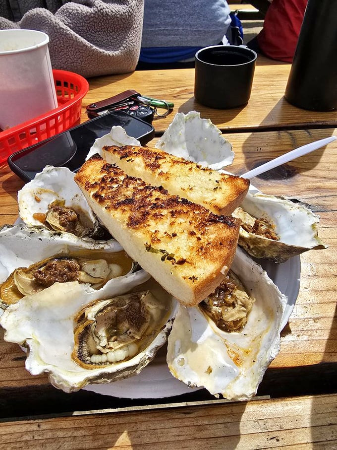 Grilled oysters and garlic bread—a match made in heaven. Like Romeo and Juliet, but with a much happier ending.