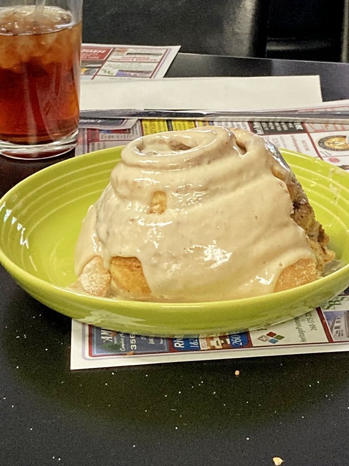 This cinnamon roll isn't just breakfast, it's an event—a spiral of morning joy topped with enough icing to make your dentist buy a new boat.
