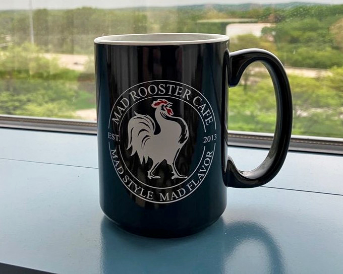 Their coffee mug doesn't just hold caffeine—it's a declaration of breakfast philosophy: "Mad Style, Mad Flavor" is more promise than slogan.