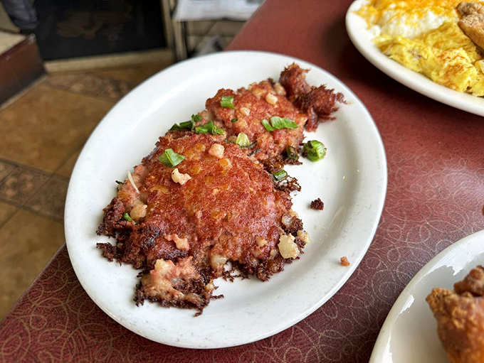 Crispy, savory corned beef hash topped with green onions – the kind of dish that makes you want to high-five the cook.