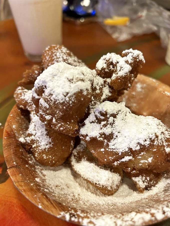 These powdered sugar-dusted fritters aren't just dessert—they're warm, doughy clouds that make you wonder why vegetables get all the deep-frying glory.