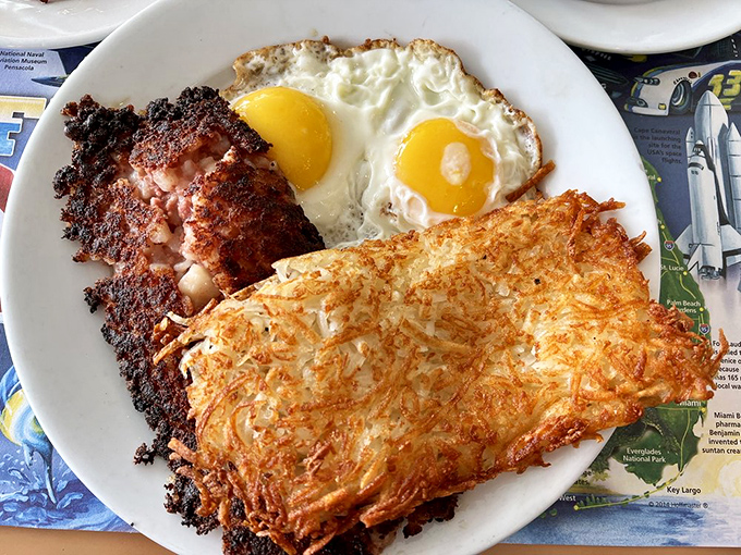Corned beef hash with eggs and hash browns—the holy trinity of breakfast that's worth setting your alarm for.