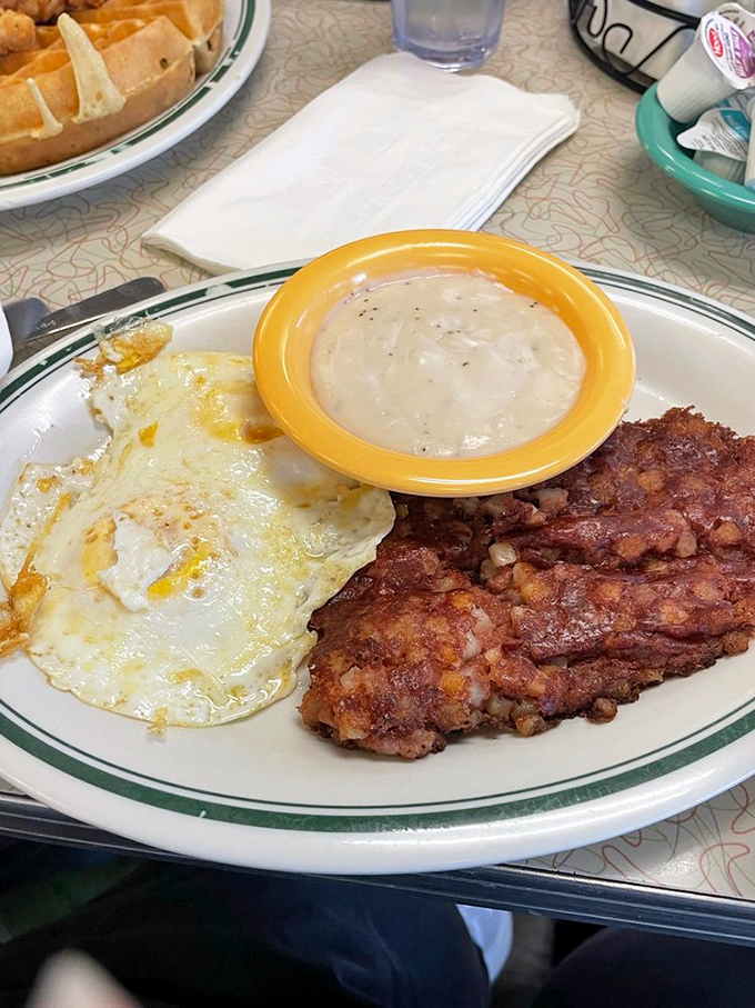 Country ham, eggs, and gravy—the holy trinity of diner breakfasts. This plate has fueled Atlanta workdays since before skyscrapers dominated the skyline.