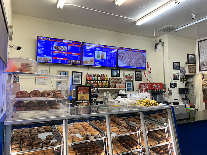 The counter view—where decisions are made, friendships are formed, and diets go to die. All under the glow of fluorescent lights and digital menus.