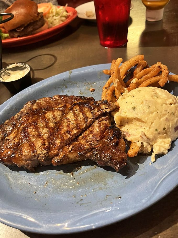 This cowboy ribeye isn't just cooked—it's been treated with the respect a good piece of beef deserves. The mashed potatoes aren't bad company either.