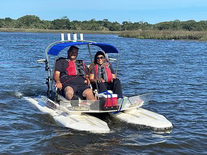 CraigCat boats let you explore the marshlands up close—like kayaking but with the dignity of not having to wiggle yourself out when you're done.