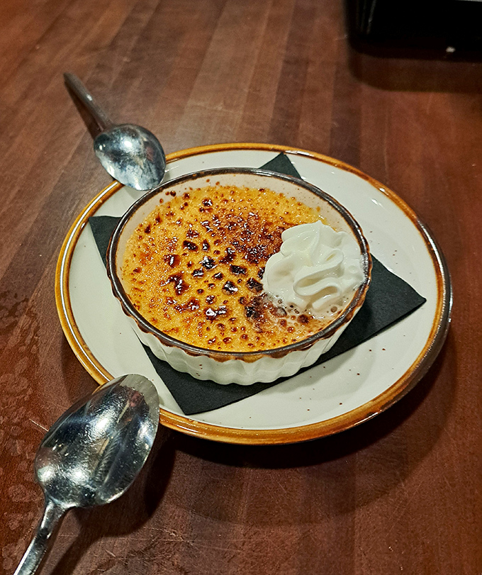 Crème brûlée with that perfect glass-like sugar top—tap it with your spoon and listen for that satisfying crack!