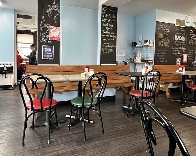 Simple wooden tables, colorful chairs, and chalkboard wisdom create a space where lingering over that last bite feels not just allowed, but encouraged.