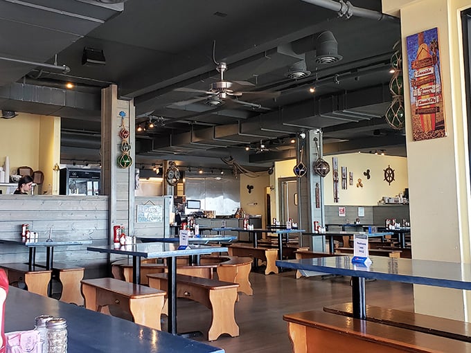 The dining room feels like the galley of a particularly welcoming ship, where nautical charm meets practical comfort and everyone's invited to the feast.