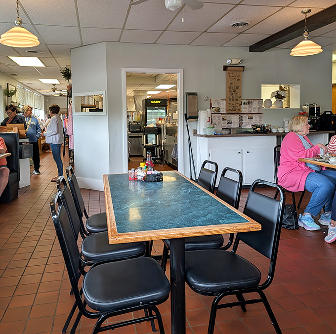 The dining area's no-nonsense charm says, "We put our energy into the food, not fancy décor." That turquoise tabletop has seen some happy eaters.