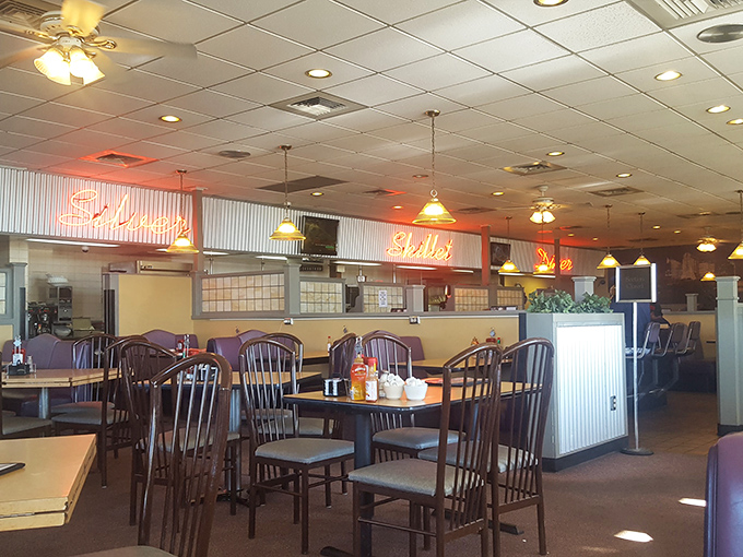 Classic diner seating that whispers tales of countless road trips, family meals, and conversations that changed lives – or at least satisfied appetites.