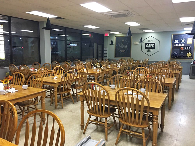 The dining room expands with traditional wooden chairs and tables, creating a space where conversations flow as freely as the coffee.