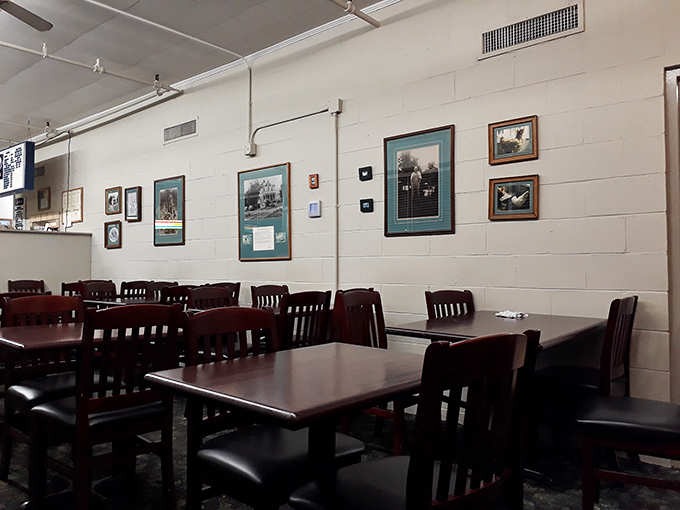 White walls adorned with local memorabilia tell stories without saying a word. Each frame holds a piece of Athens history.