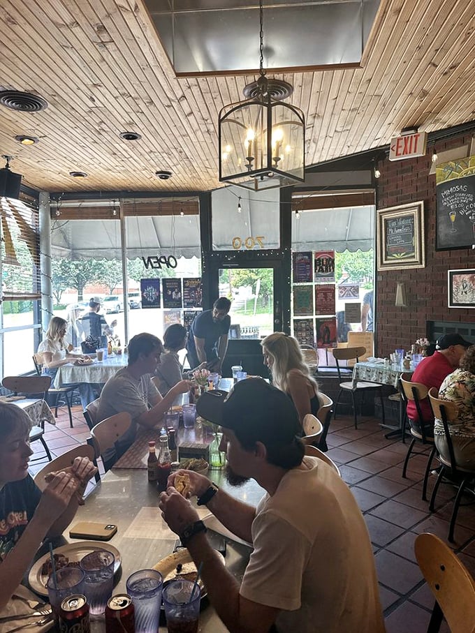 The dining room buzzes with conversation and clinking forks—a symphony of satisfaction conducted under warm wooden ceilings.