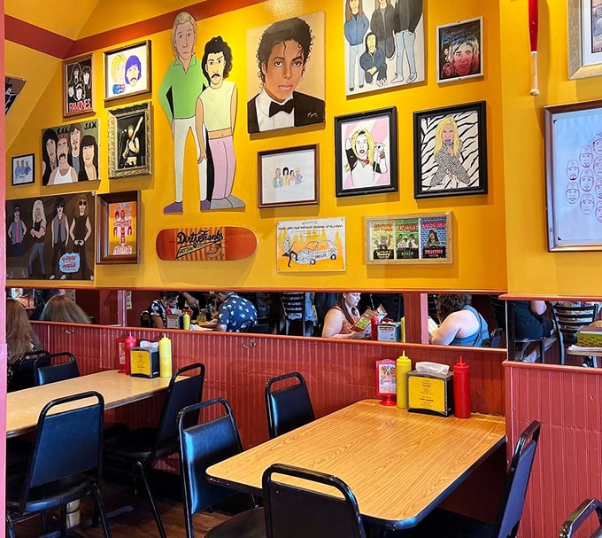 The walls tell stories through eclectic art while diners create their own memories at simple wooden tables—democratic dining at its finest.