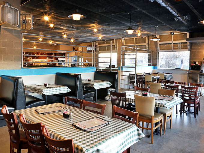 The dining area balances no-nonsense functionality with casual charm. Those checkered tablecloths aren't being ironic—they're being Texan.