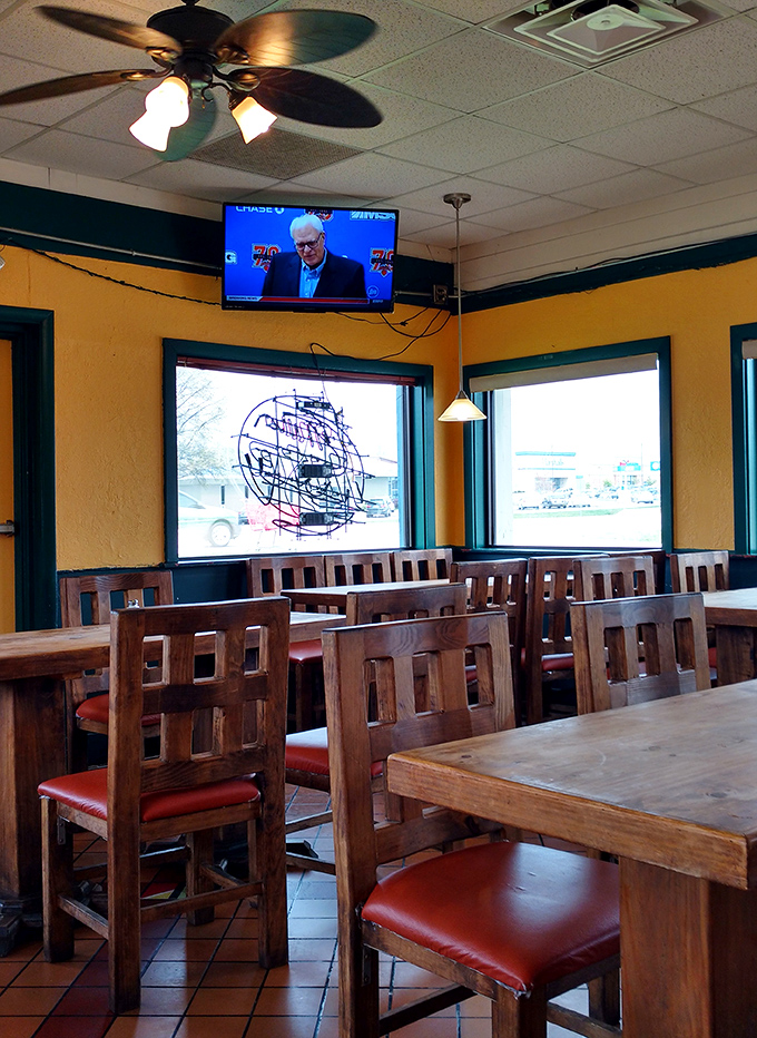 Wooden chairs and yellow walls create the perfect backdrop for culinary memories. This isn't dining—it's a cultural immersion with table service.