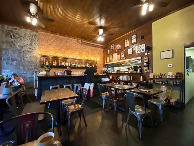 Industrial meets homey in this dining space where every seat feels like the best one in the house. The ceiling fans ensure the only thing overheated is the conversation.
