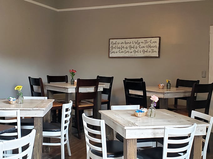 Simple wooden tables and chairs create a distraction-free zone for serious cheesecake contemplation – no fancy décor competing with the star attraction.
