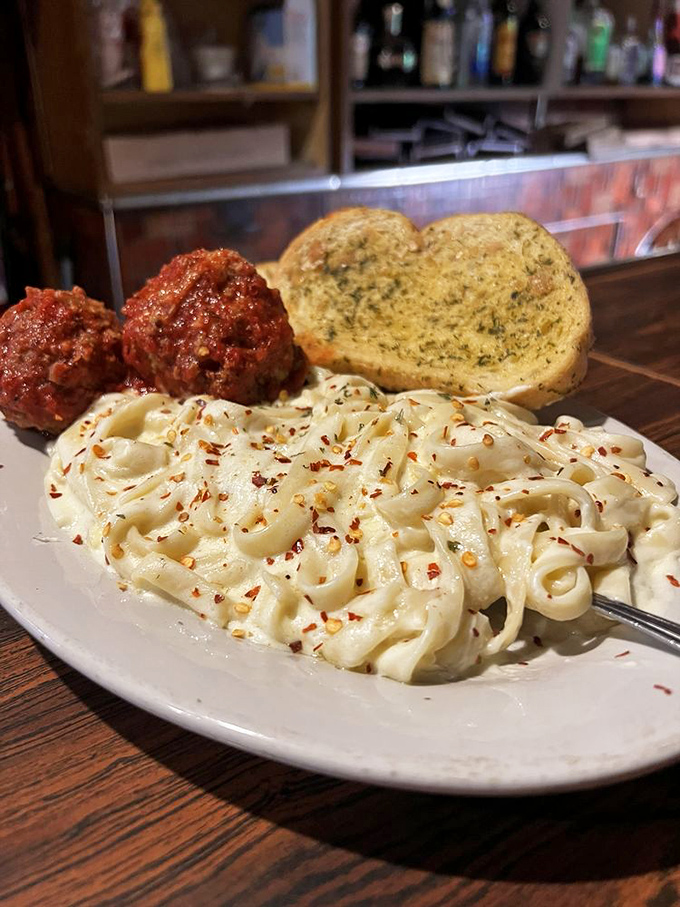 Fettuccine Alfredo with meatballs that would make your Italian grandmother weep with joy. Comfort food that hugs your soul from the inside.