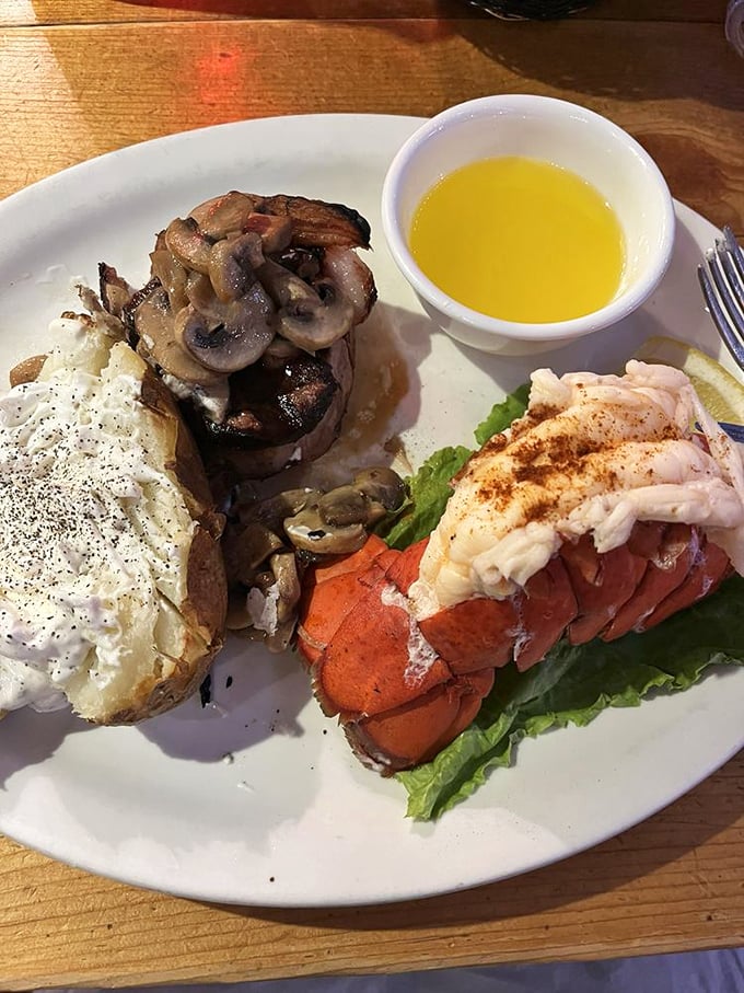 Surf and turf nirvana achieved. That filet mignon topped with mushrooms alongside a lobster tail is what food dreams are made of—no alarm clock needed.
