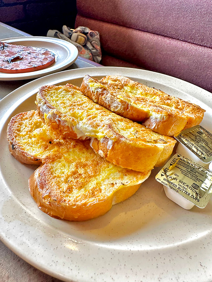 French toast so golden and perfect it makes you wonder why anyone bothers with fancy brunch spots charging triple for Instagram aesthetics.