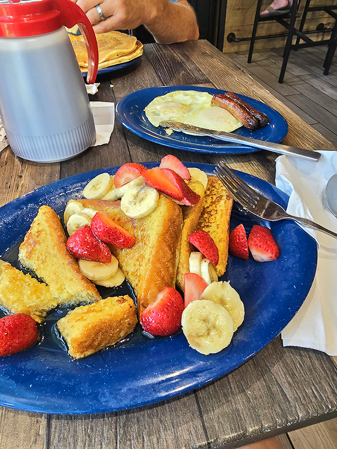 French toast that makes you question every other breakfast you've ever had—adorned with fresh fruit like edible jewelry.
