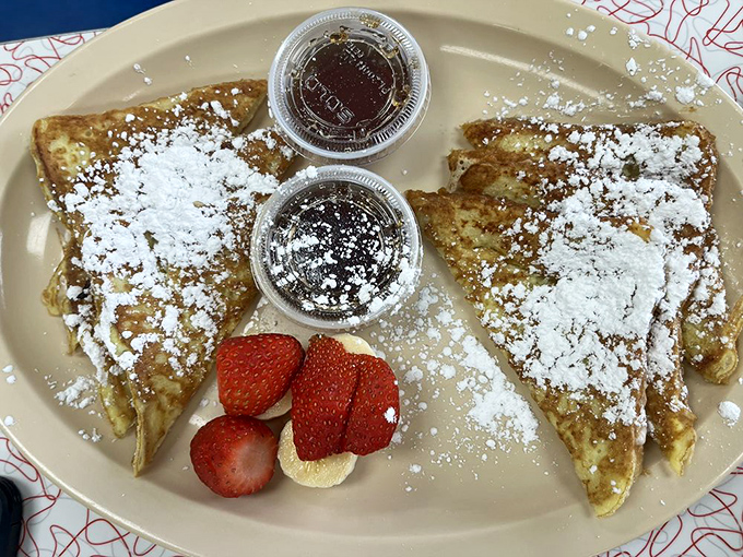 French toast dusted with powdered sugar snow and fresh berries—proof that breakfast can be both comforting and slightly fancy at the same time.