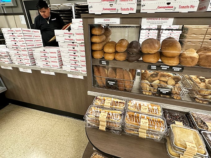 The bread counter, stacked with fresh-baked loaves, represents carbohydrate heaven—each one promising to elevate your sandwich game to legendary status.