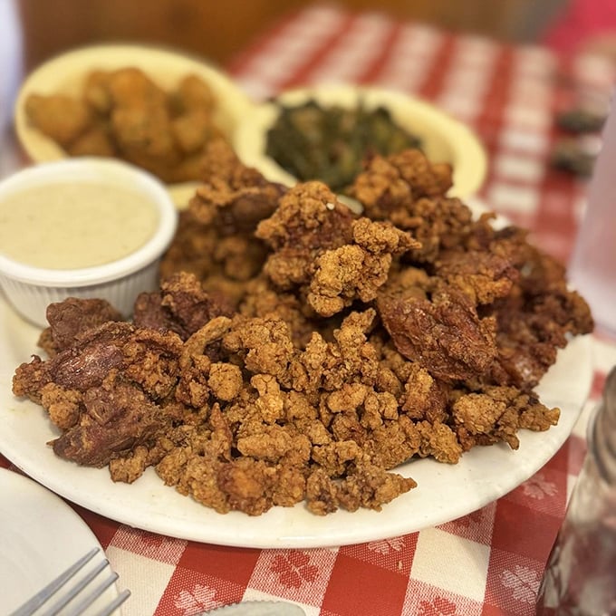 Crispy fried chicken livers, hush puppies, and hash brown casserole—the holy trinity of Southern indulgence. Diets come to die on plates like this.