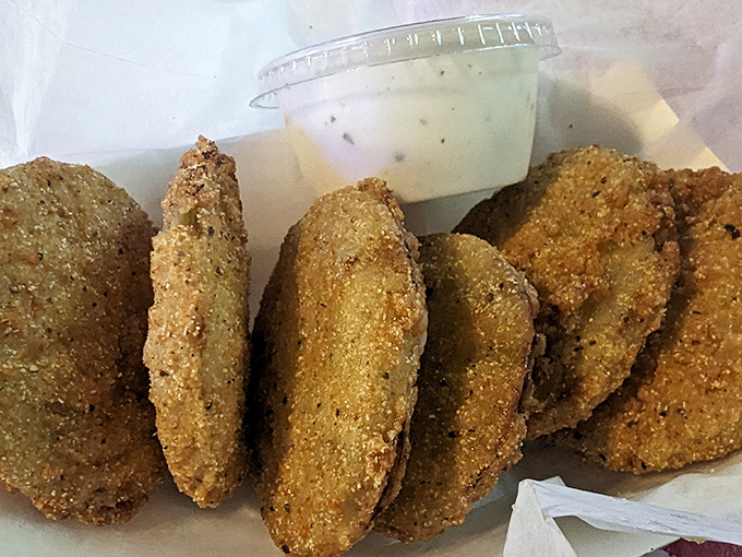Fried green tomatoes with ranch dipping sauce—tangy, crispy discs of joy that make vegetables feel like an indulgence.