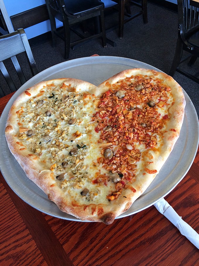 Love at first bite! This heart-shaped pizza proves romance isn't dead—it just needed more cheese and two distinct topping personalities.