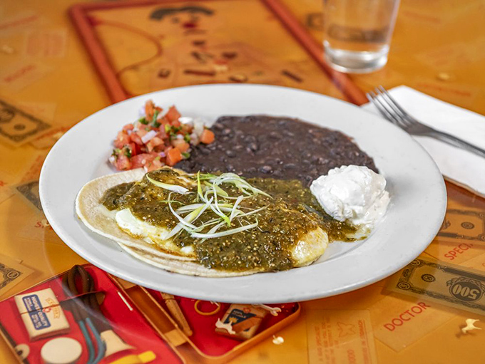 Huevos Rancheros that transport you straight to flavor country – where tortillas, beans, and perfectly cooked eggs unite under a blanket of vibrant salsa verde.
