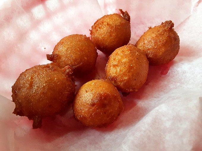 Golden-fried hushpuppies – little orbs of cornmeal perfection that were invented because someone brilliant said, "What if we fried cornbread batter?"