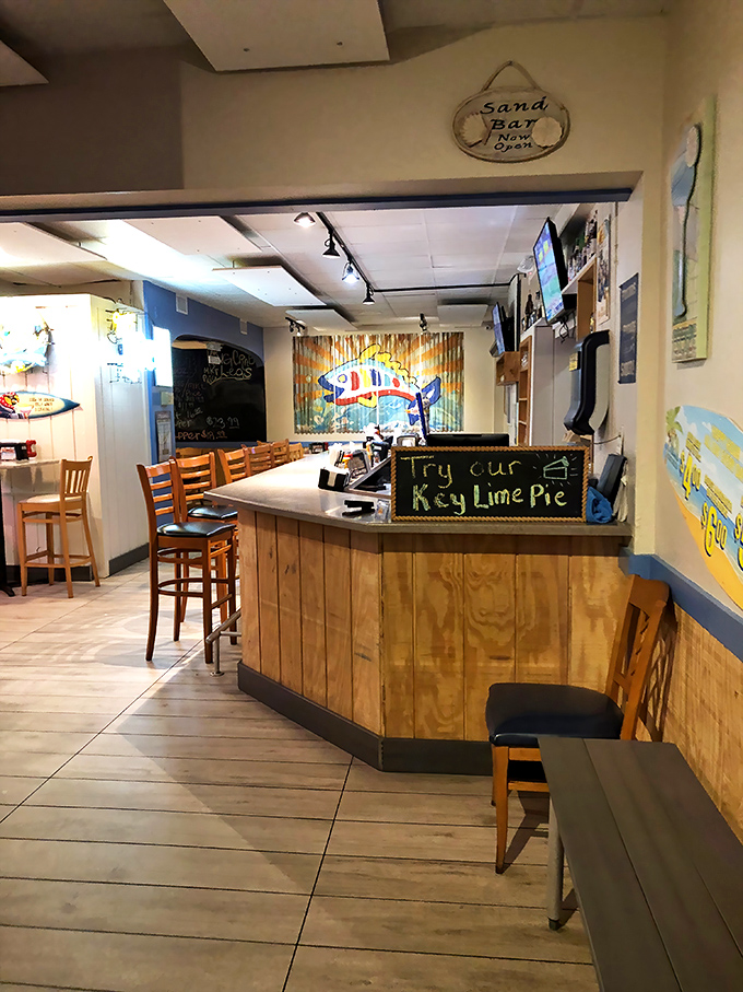 The "Sand Bar" offers a casual spot to enjoy a drink while contemplating life's important questions—like which seafood dish to order next.