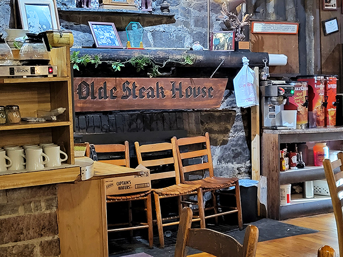 Every corner tells a story in this dining room, where the wooden sign promises steaks but the atmosphere delivers a side of Tennessee nostalgia.