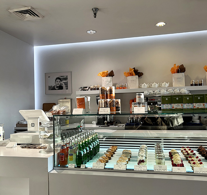 The display case—where dreams are stored at precisely the right temperature. Each pastry waits patiently for its moment of glory.
