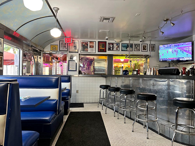 Blue booths, vintage photographs, and a TV for sports—because sometimes you need to watch the game while debating the merits of breakfast for dinner.