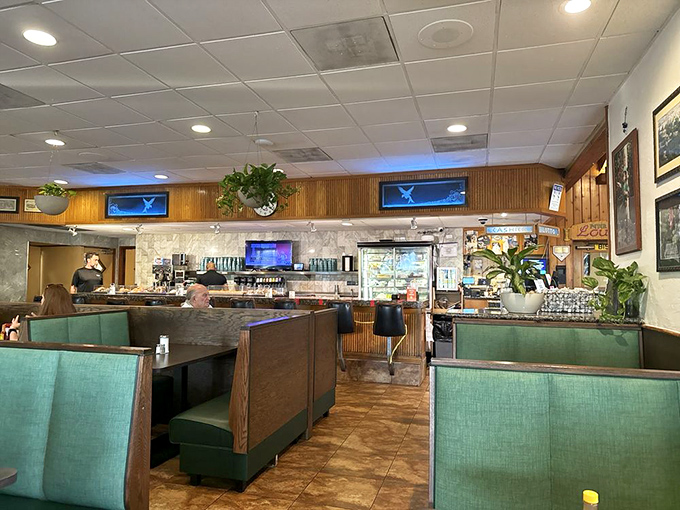 The command center of comfort food, where coffee flows freely and breakfast dreams come true. Notice those hanging plants!