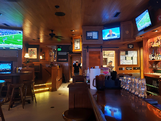 Sports on every screen, wood everywhere, and the promise of cold drinks—this is what heaven looks like to many Iowans on game day.