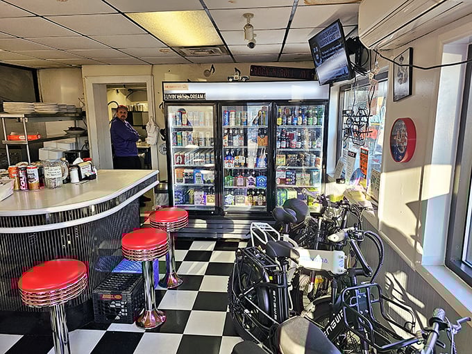 Where beverages go to show off. The cooler display is like a liquid rainbow of possibilities, with classic sodas standing at attention.
