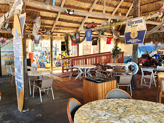 Thatched roof, hanging t-shirts, and the promise of cold drinks—the dining area feels like the best beach bar you discovered on that Caribbean vacation.