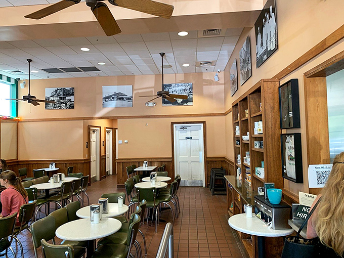 The dining room's unpretentious charm lets you focus on what matters. No Edison bulbs or reclaimed wood here—just straightforward tables for serious beignet business.