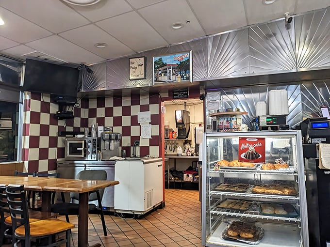 The checkered walls aren't trying to be retro-cool; they've earned their vintage status the hard way—by actually being vintage.