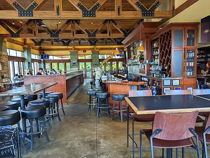 Exposed wooden beams and thoughtful design create a space that feels both grand and intimate—like dining in a modern mountain lodge designed by someone with excellent taste.
