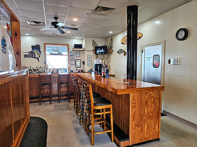 The bar area—where fishing stories get taller and seafood decisions get serious. That wooden paneling has heard it all.