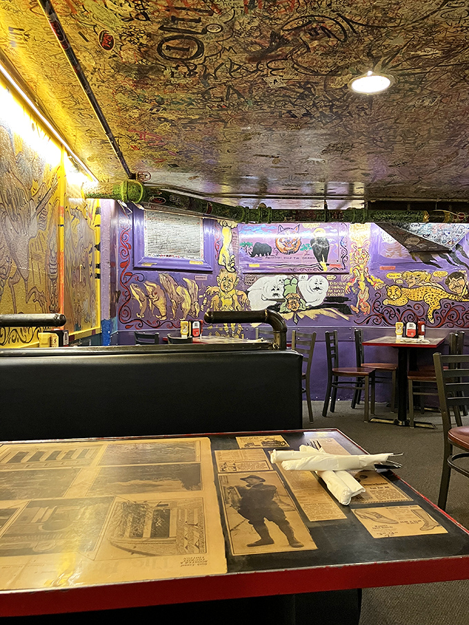 Purple walls, signature-covered ceilings, and vintage memorabilia—dining at The Sink is like eating inside a rock star's scrapbook.